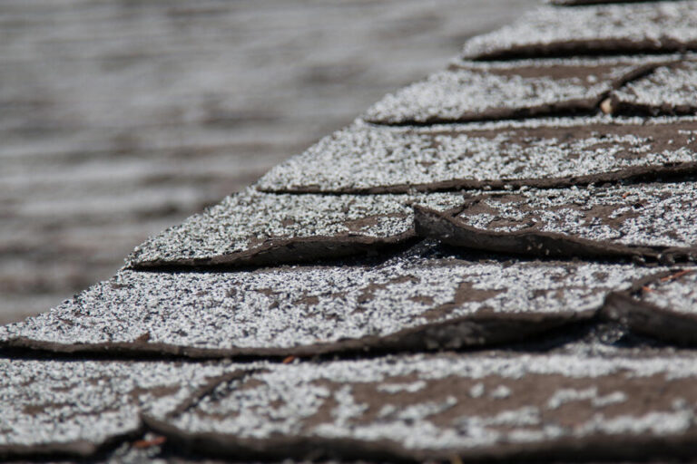7 Signs & Symptoms Of Buckling Shingles On Your Roof